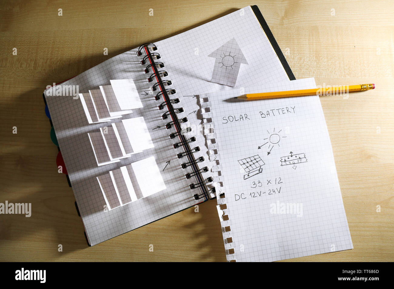 Applique paper with building and solar panels in notebook Stock Photo ...