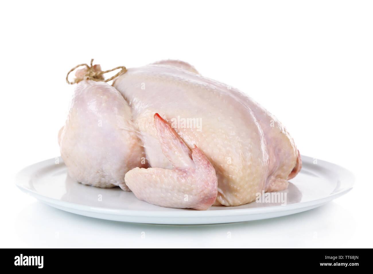Raw chicken isolated on white Stock Photo - Alamy