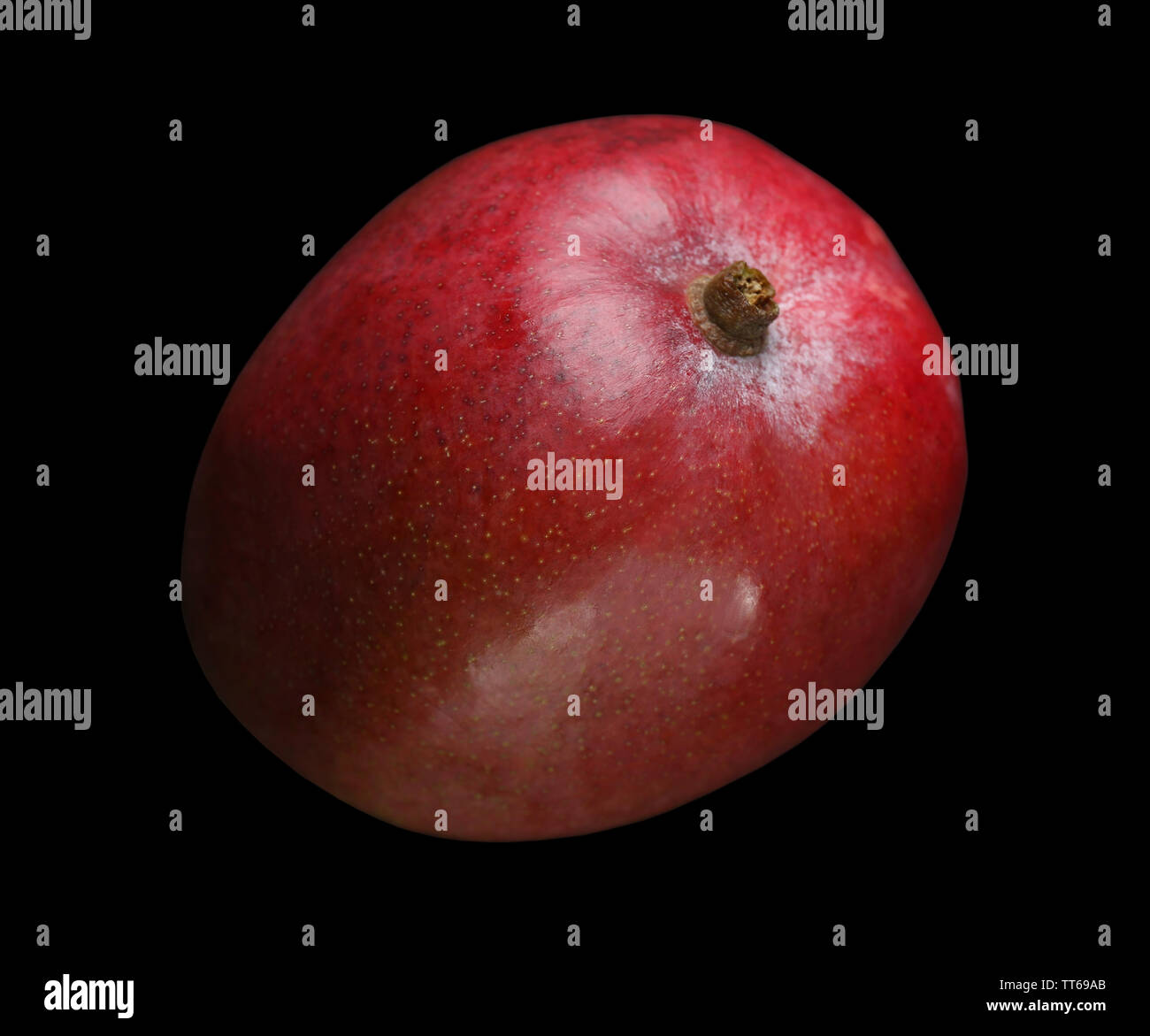 Mango on black background Stock Photo - Alamy