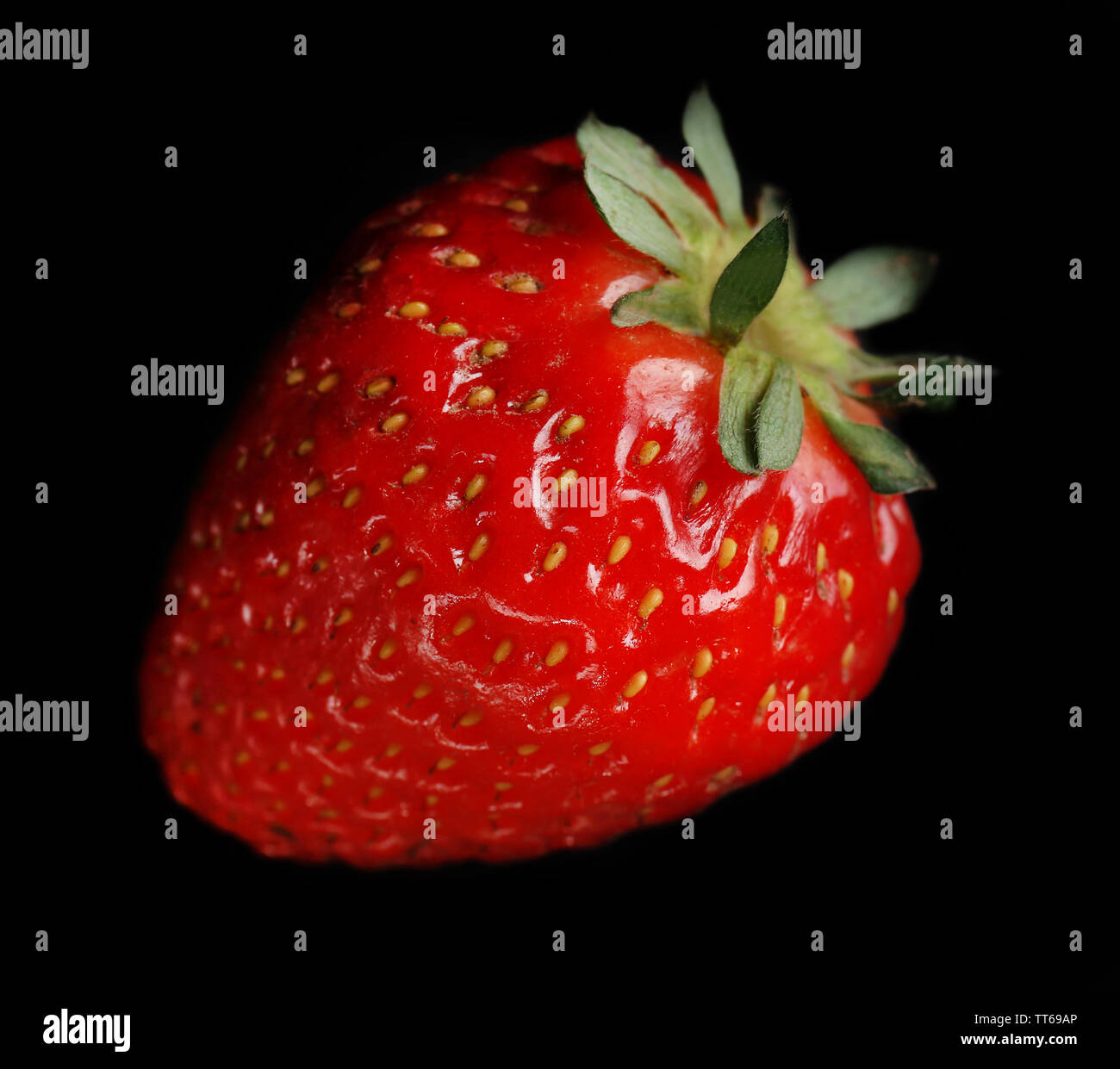Strawberry on black background Stock Photo - Alamy