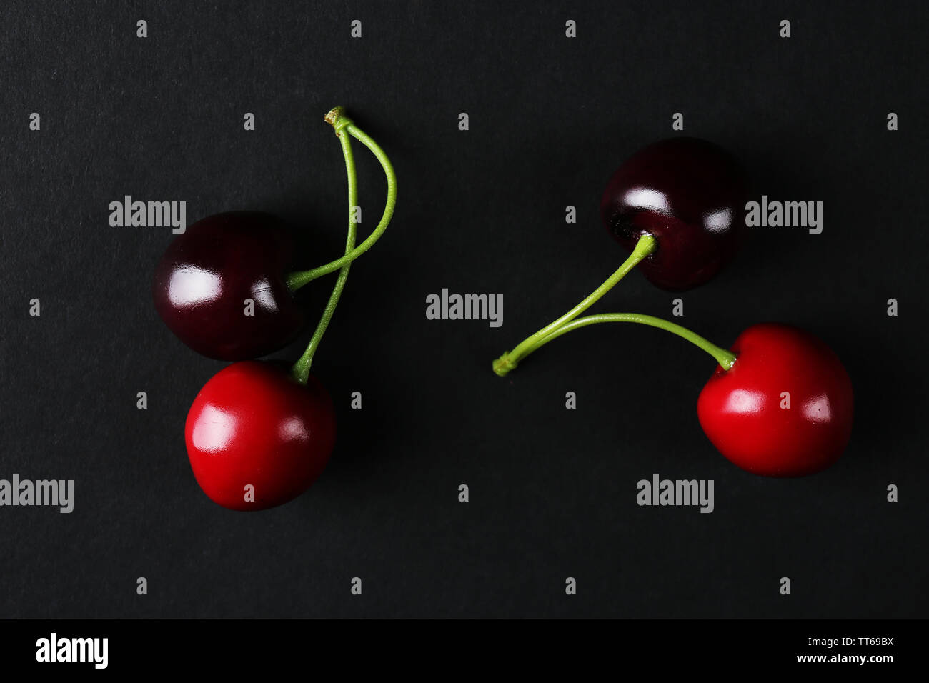 Cherry on black background Stock Photo - Alamy