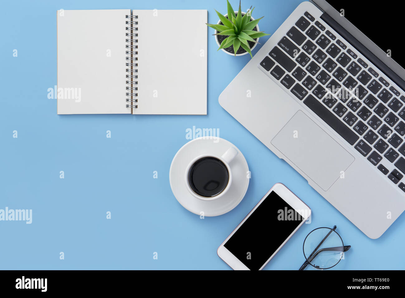 Business concept. Clean bright light blue office table desk, minimal ...