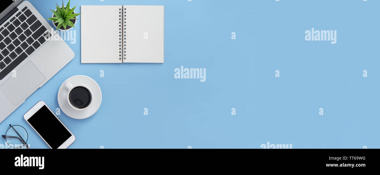 Business concept. Clean bright light blue office table desk, minimal ...