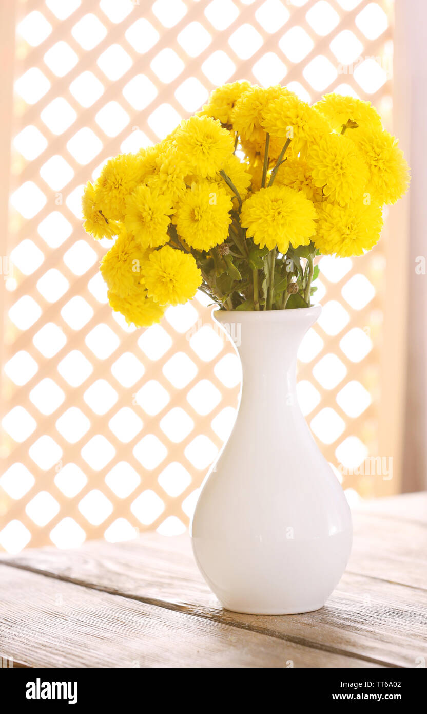Beautiful flowers in vase with light from window Stock Photo - Alamy