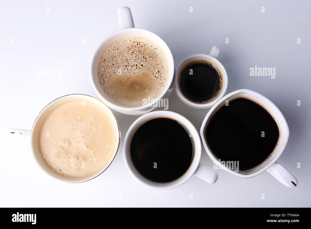 Lots of coffee cups on white background Stock Photo - Alamy