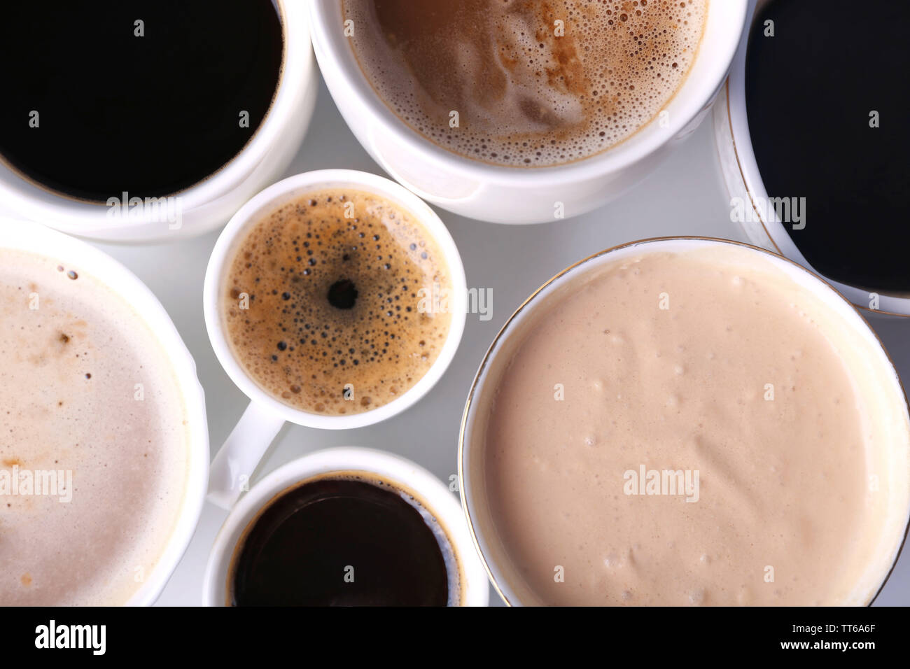 Lots of coffee cups on white background Stock Photo - Alamy