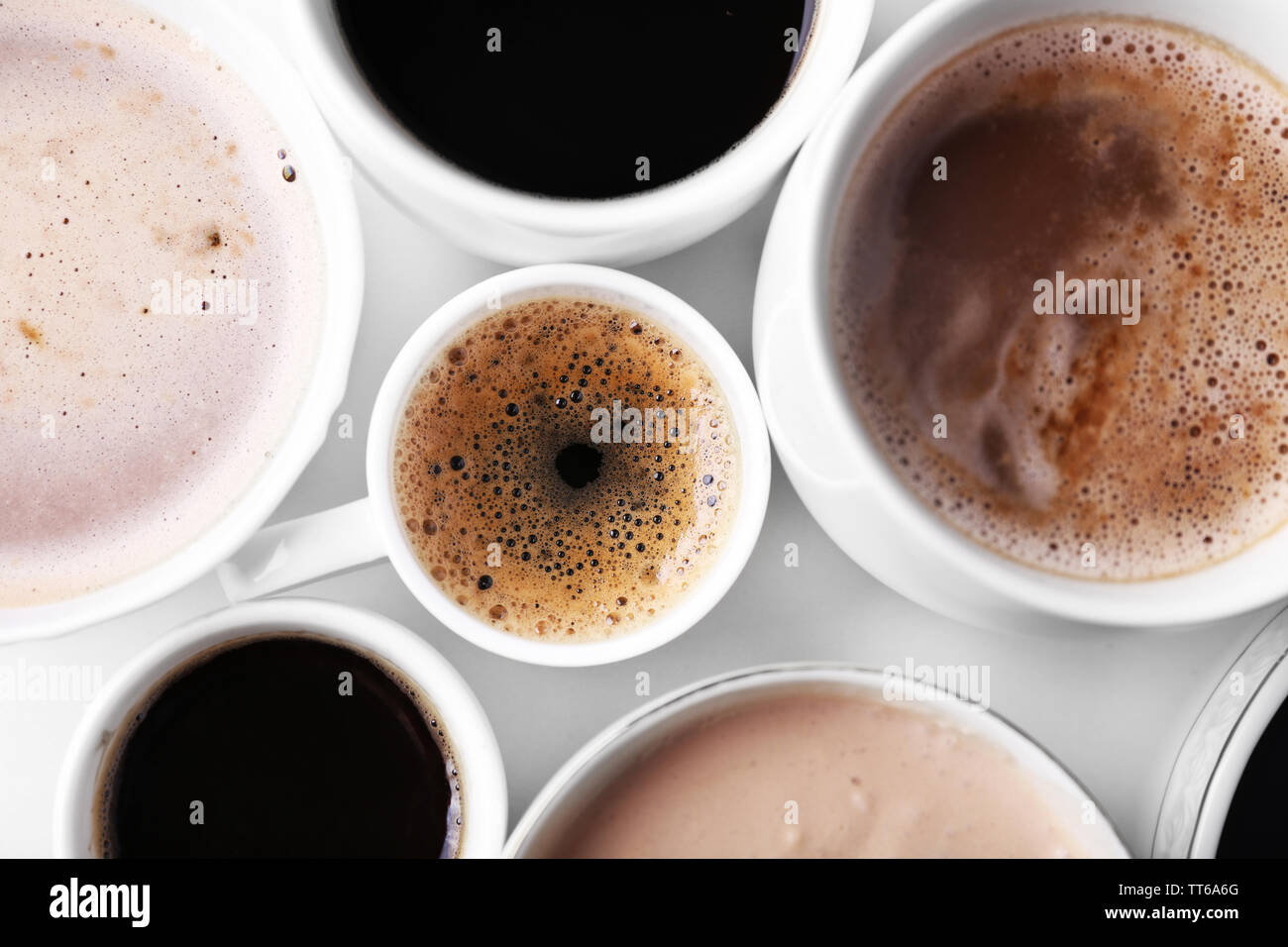 Lots of coffee cups on white background Stock Photo - Alamy
