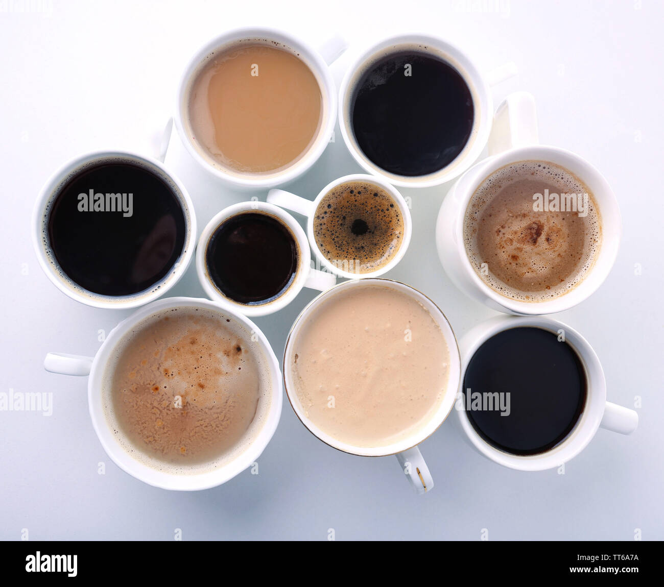 Lots of coffee cups on white background Stock Photo - Alamy