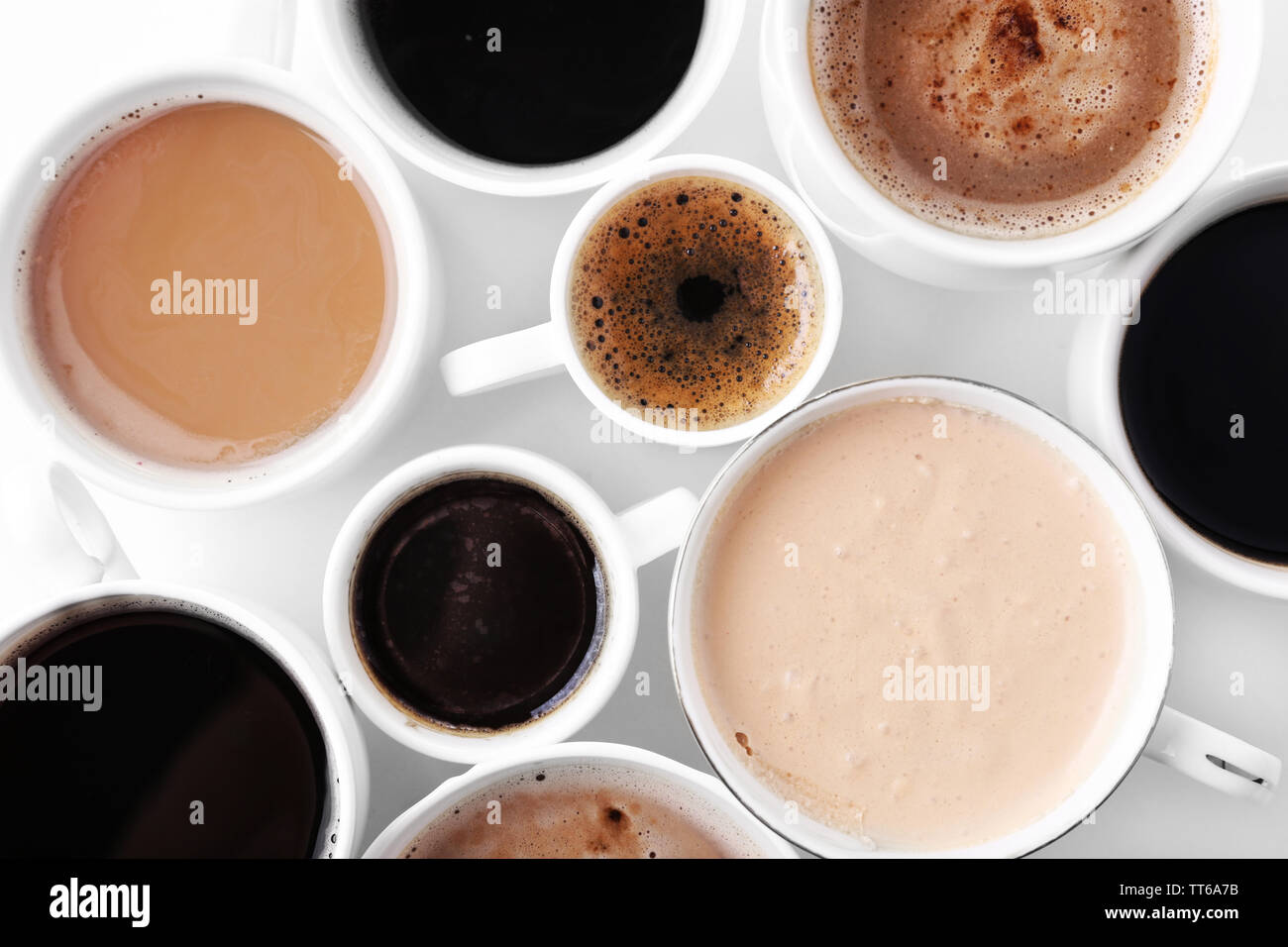 Lots of coffee cups on white background Stock Photo - Alamy