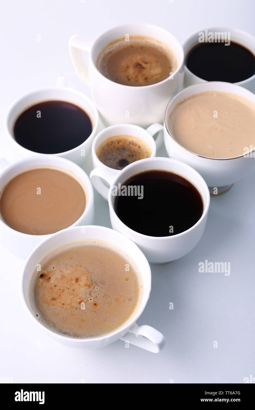 Lots of coffee cups on white background Stock Photo - Alamy