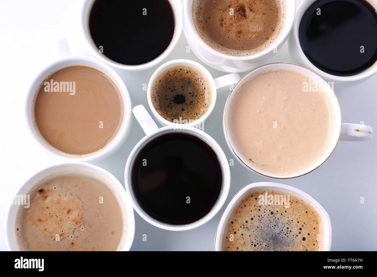 Lots of coffee cups on white background Stock Photo - Alamy