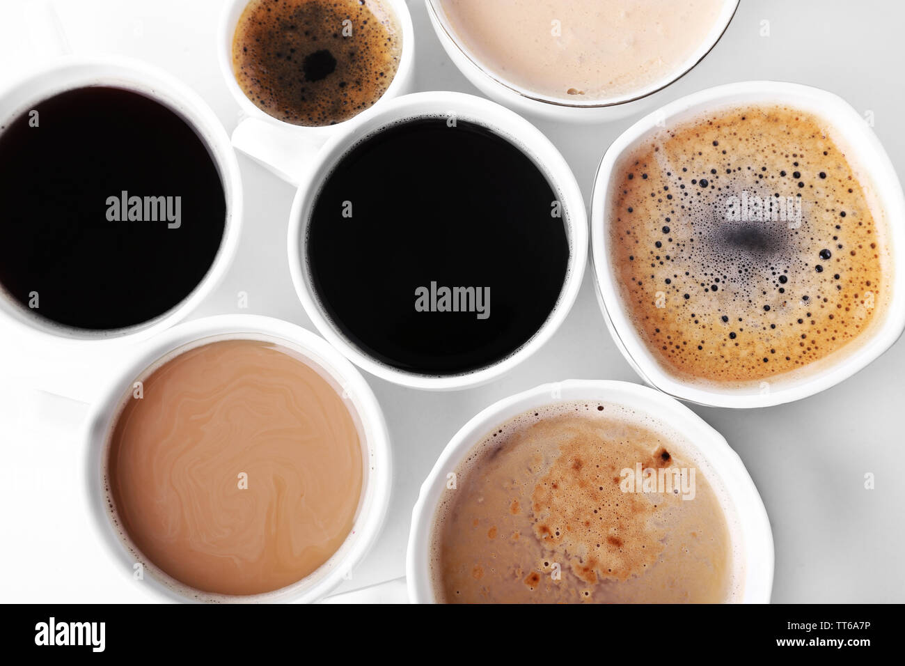 Lots of coffee cups on white background Stock Photo - Alamy