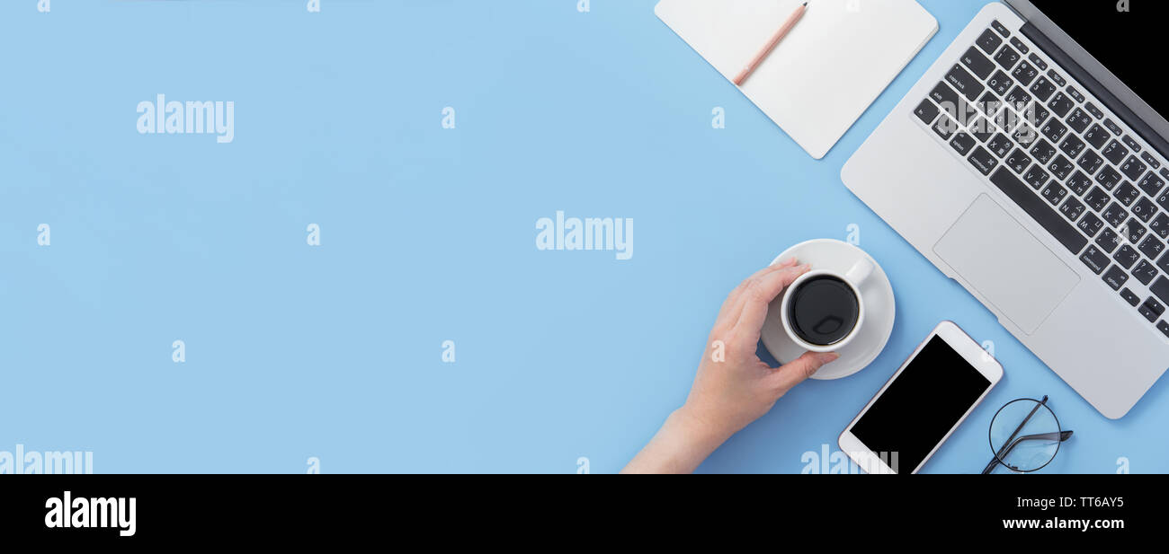 Business concept. Clean bright light blue office table desk, minimal ...