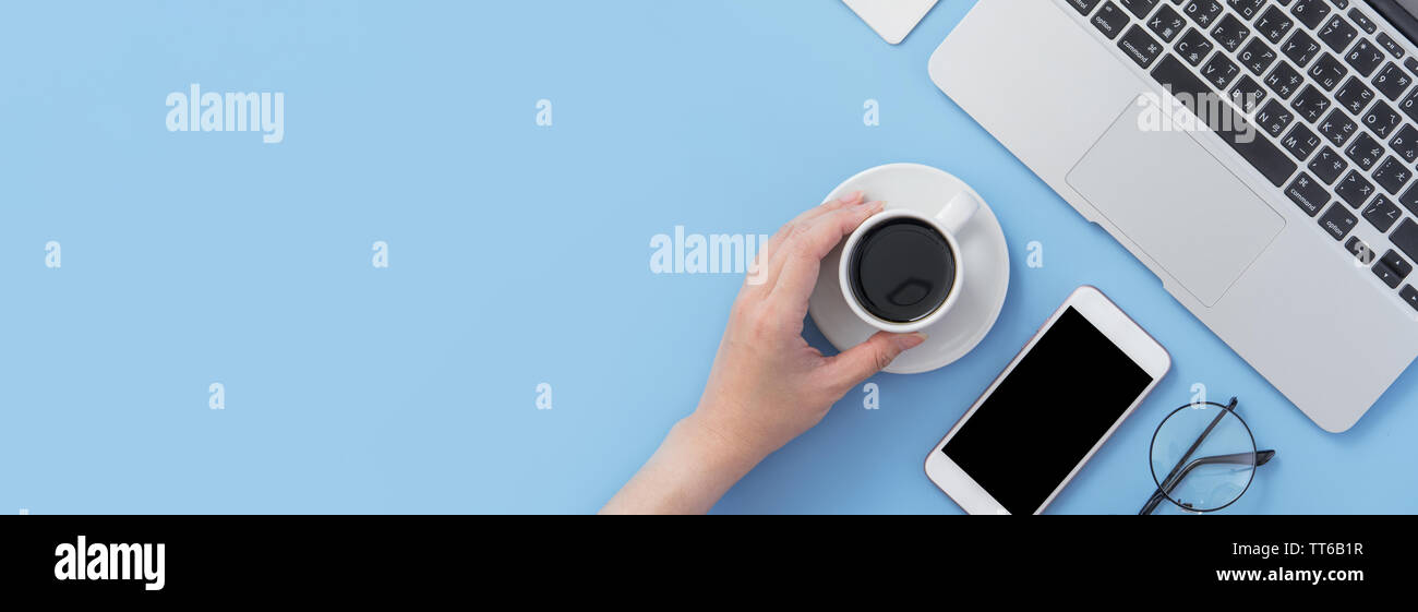 Business concept. Clean bright light blue office table desk, minimal ...