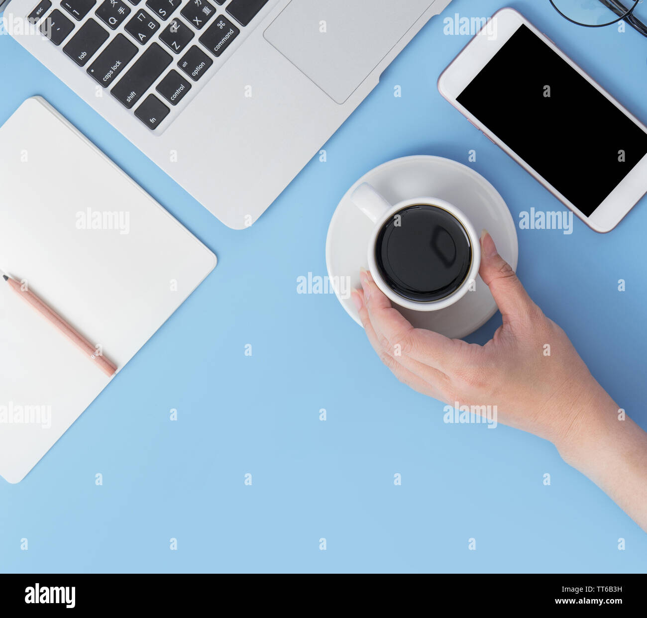 Business concept. Clean bright light blue office table desk, minimal ...