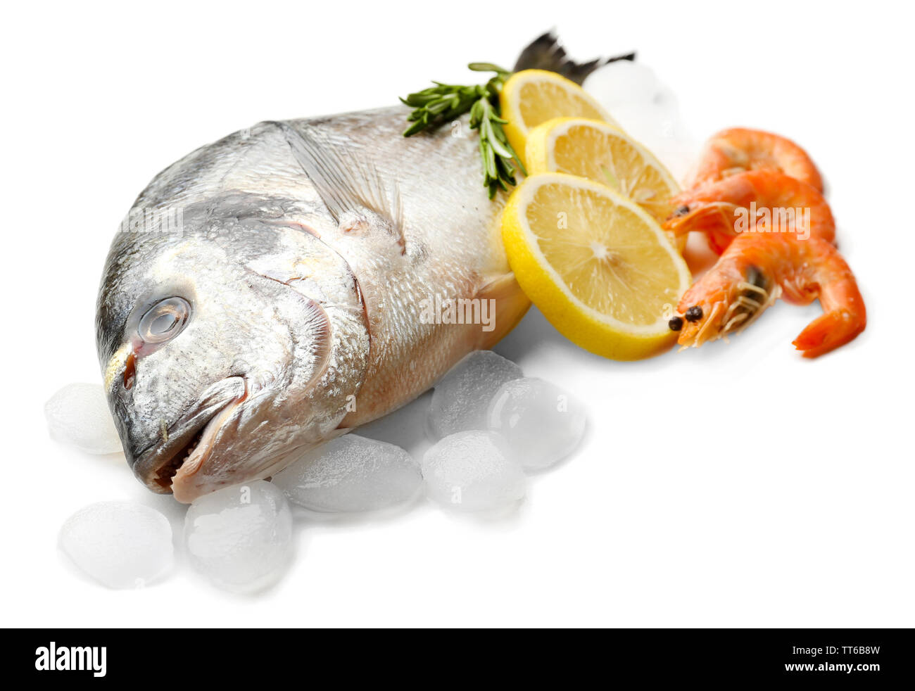 Fresh fish with ice isolated on white Stock Photo - Alamy