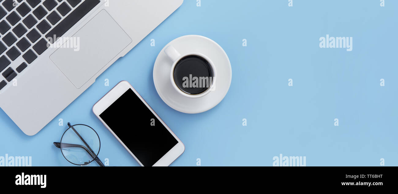 Business concept. Clean bright light blue office table desk, minimal ...