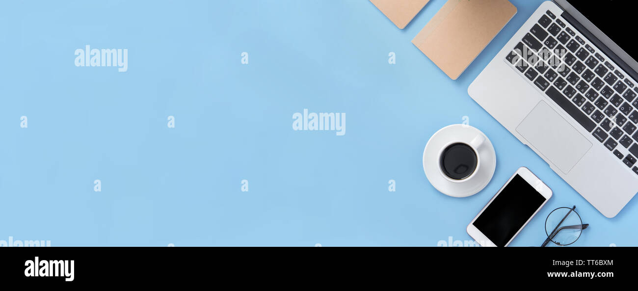 Business concept. Clean bright light blue office table desk, minimal ...