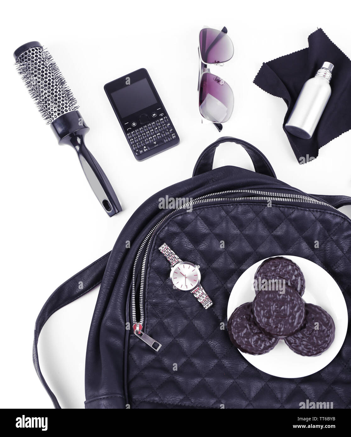 Content female handbag isolated on white Stock Photo - Alamy