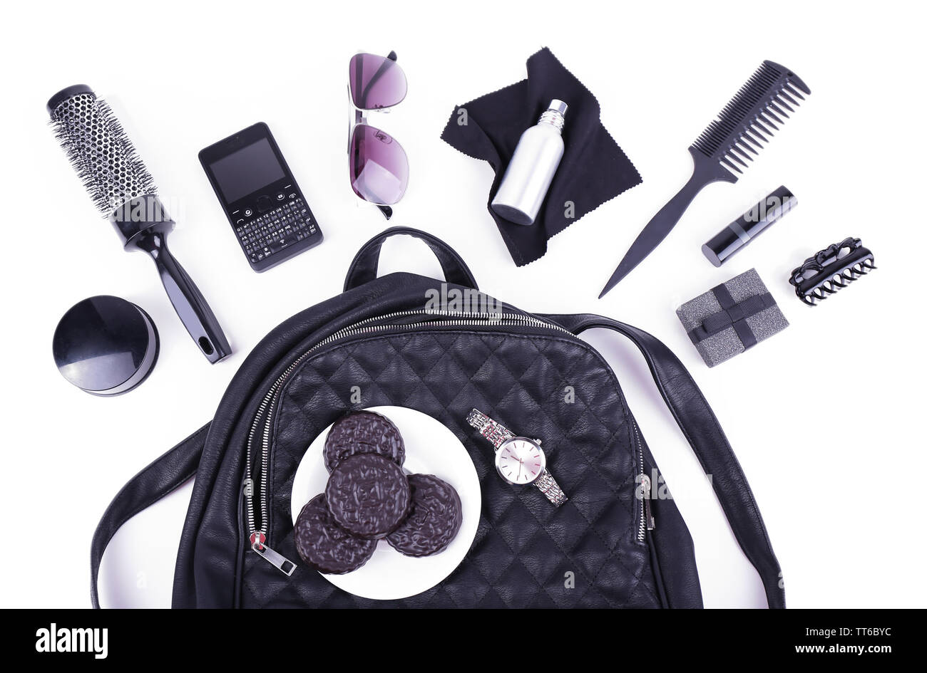 Content female handbag isolated on white Stock Photo - Alamy