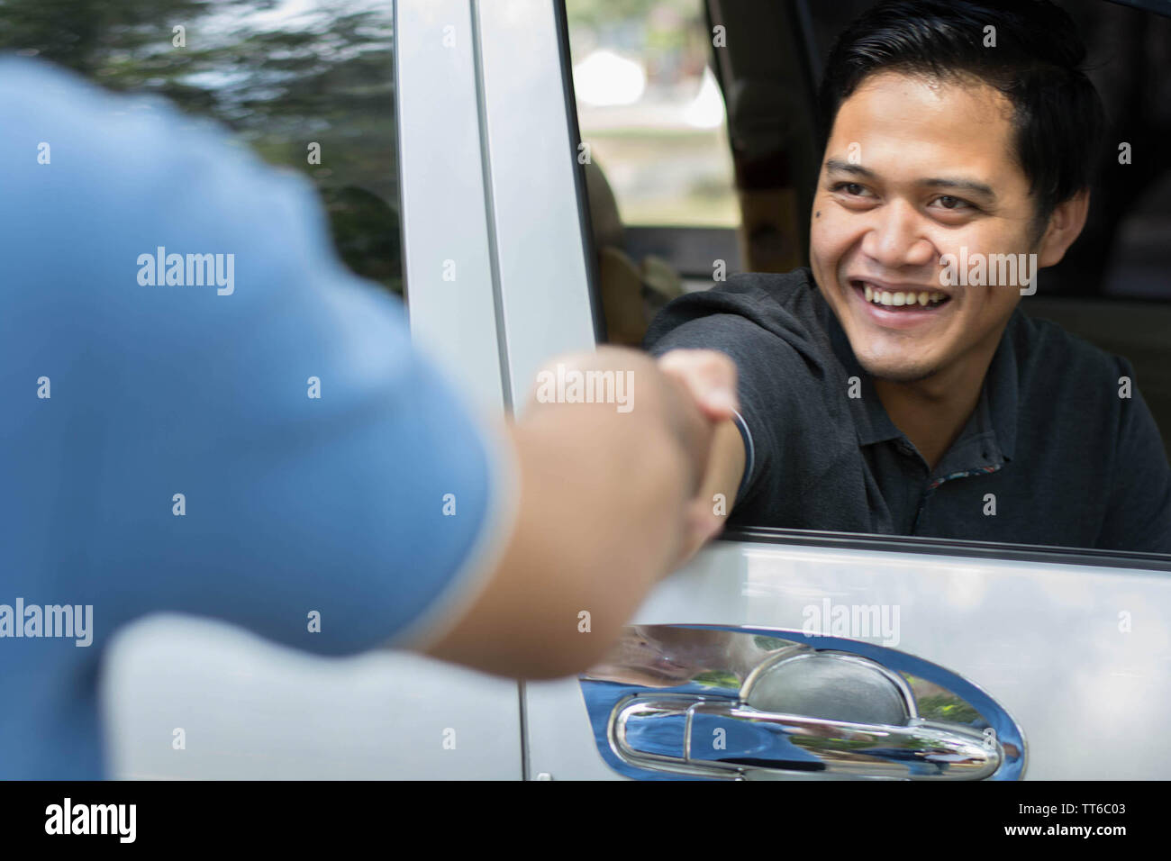 Young asian friend driving car hi-res stock photography and images - Alamy