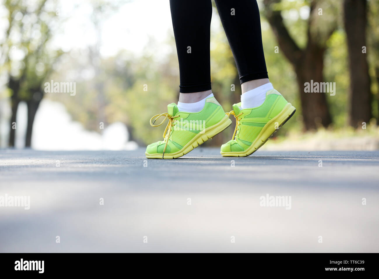 Runner feet on road, outdoors Stock Photo - Alamy