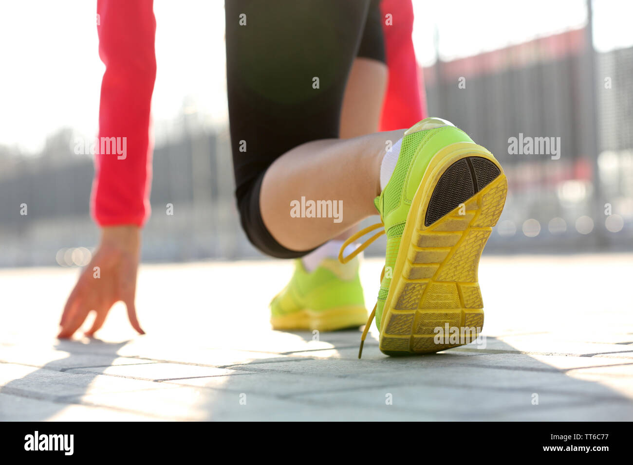 Runner in start position Stock Photo - Alamy
