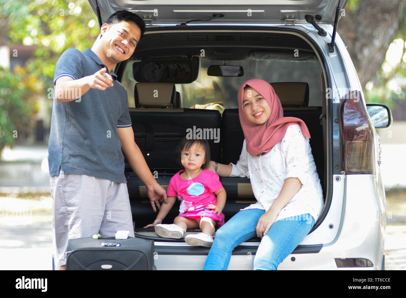 young muslim family , transport, leisure, road trip and people concept ...