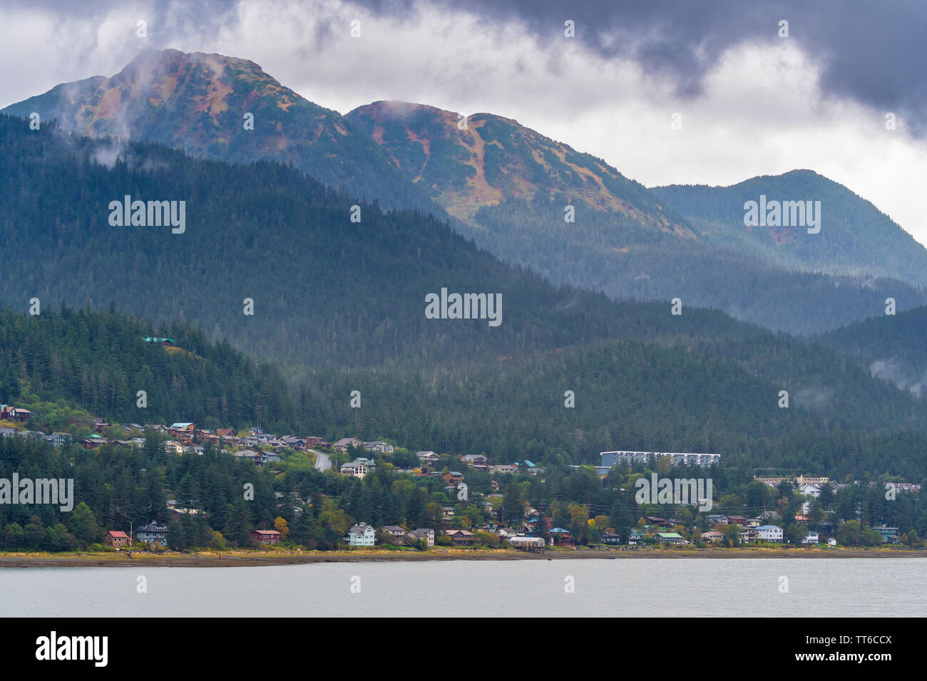 Scenic mountain landscapes in Juneau, Alaska. Community of homes/houses ...