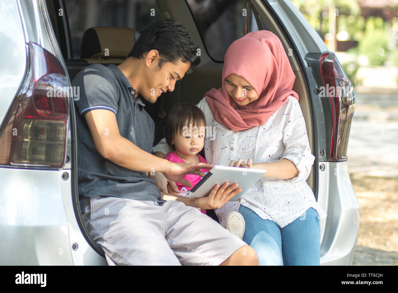 young muslim family , transport, leisure, road trip and people concept ...