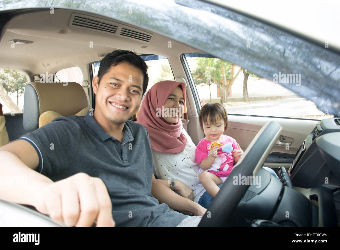 young muslim family , transport, leisure, road trip and people concept ...