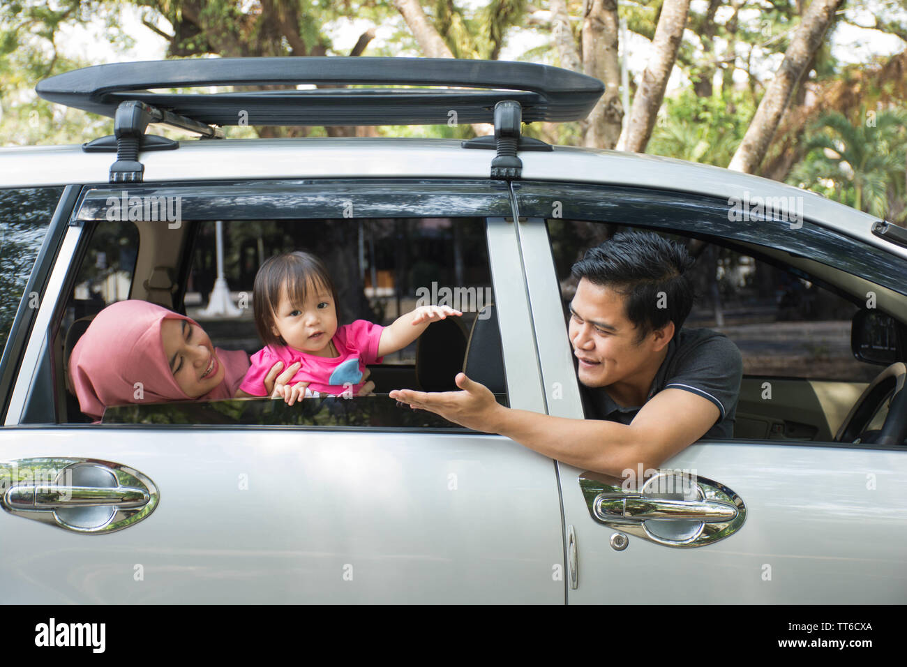 young muslim family , transport, leisure, road trip and people concept ...