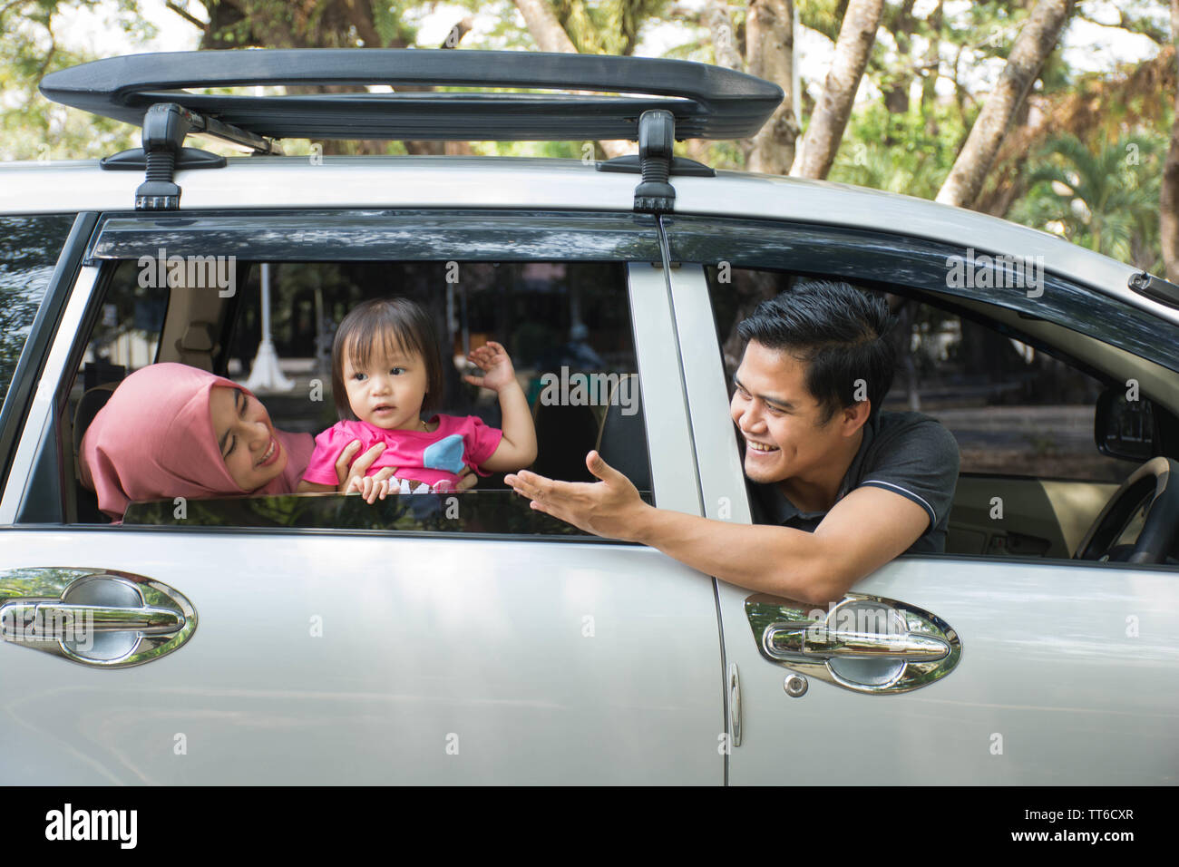 young muslim family , transport, leisure, road trip and people concept ...
