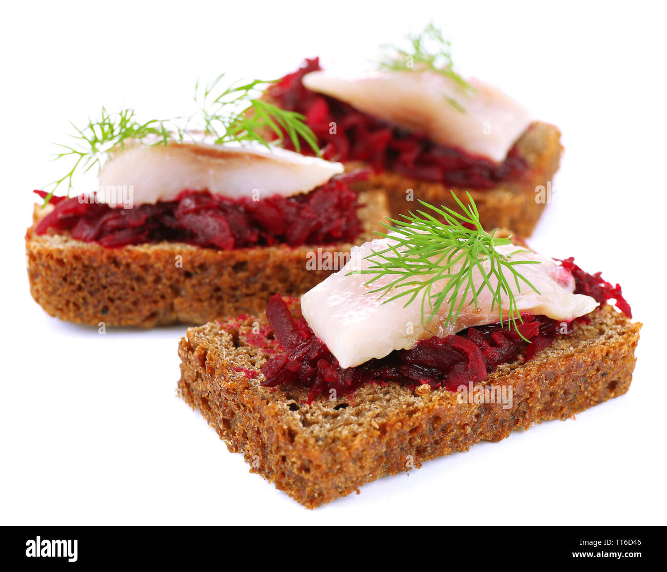 Canape herring with beets on rye toast, isolated on white Stock Photo ...