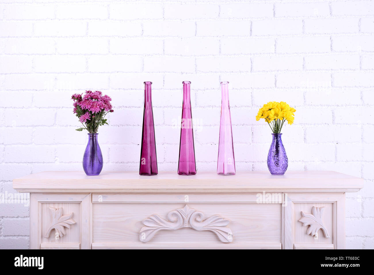 Fireplace with beautiful purple decorations in room Stock Photo - Alamy