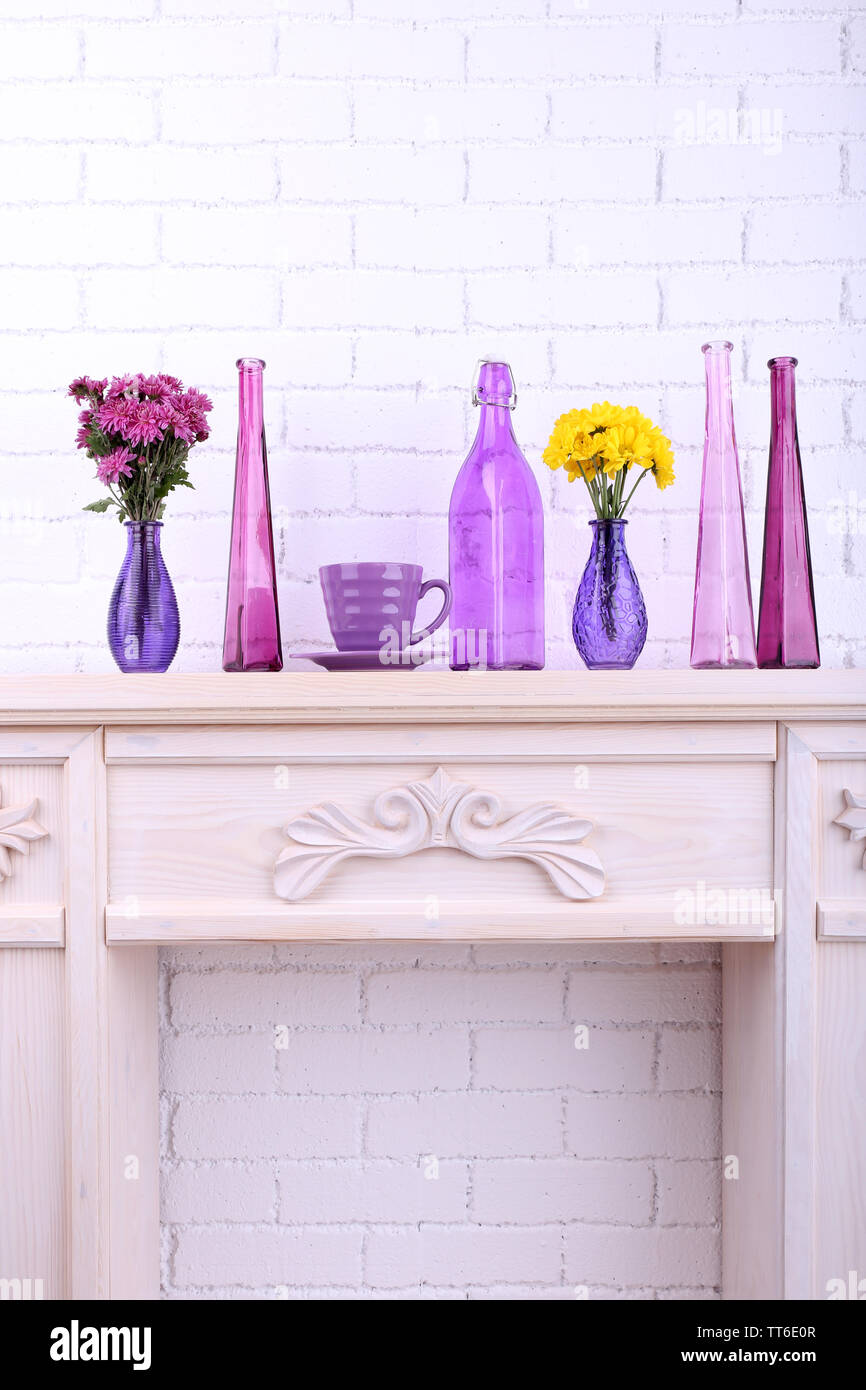 Fireplace with beautiful purple decorations in room Stock Photo - Alamy