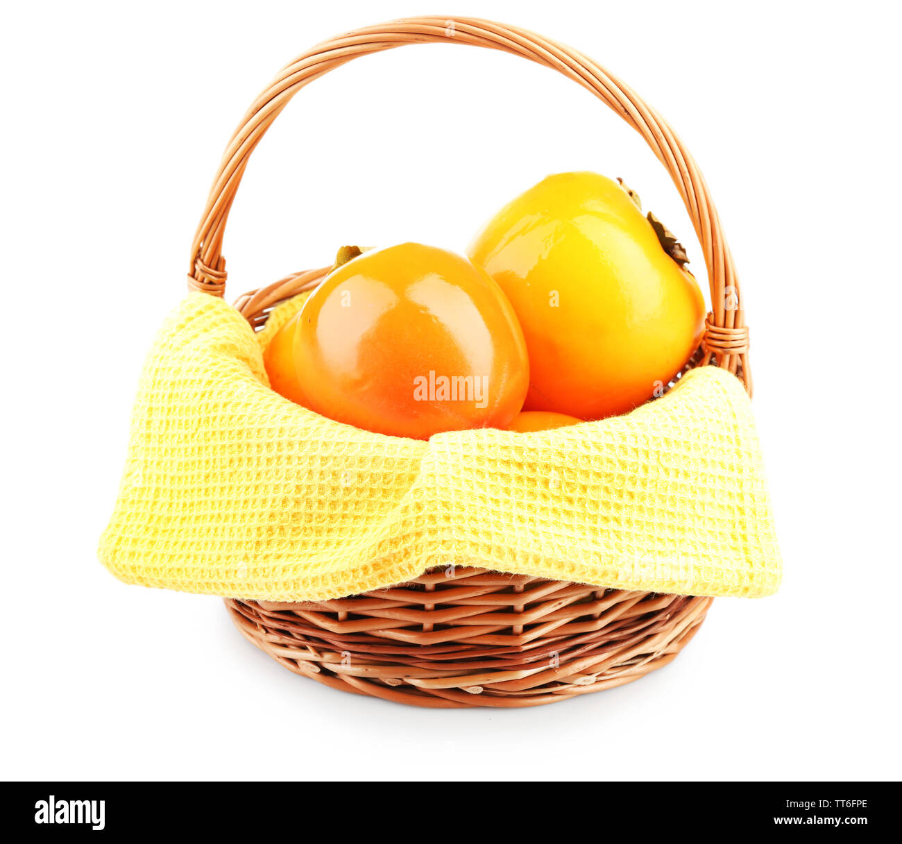 Ripe persimmons in wicker basket isolated on white Stock Photo - Alamy