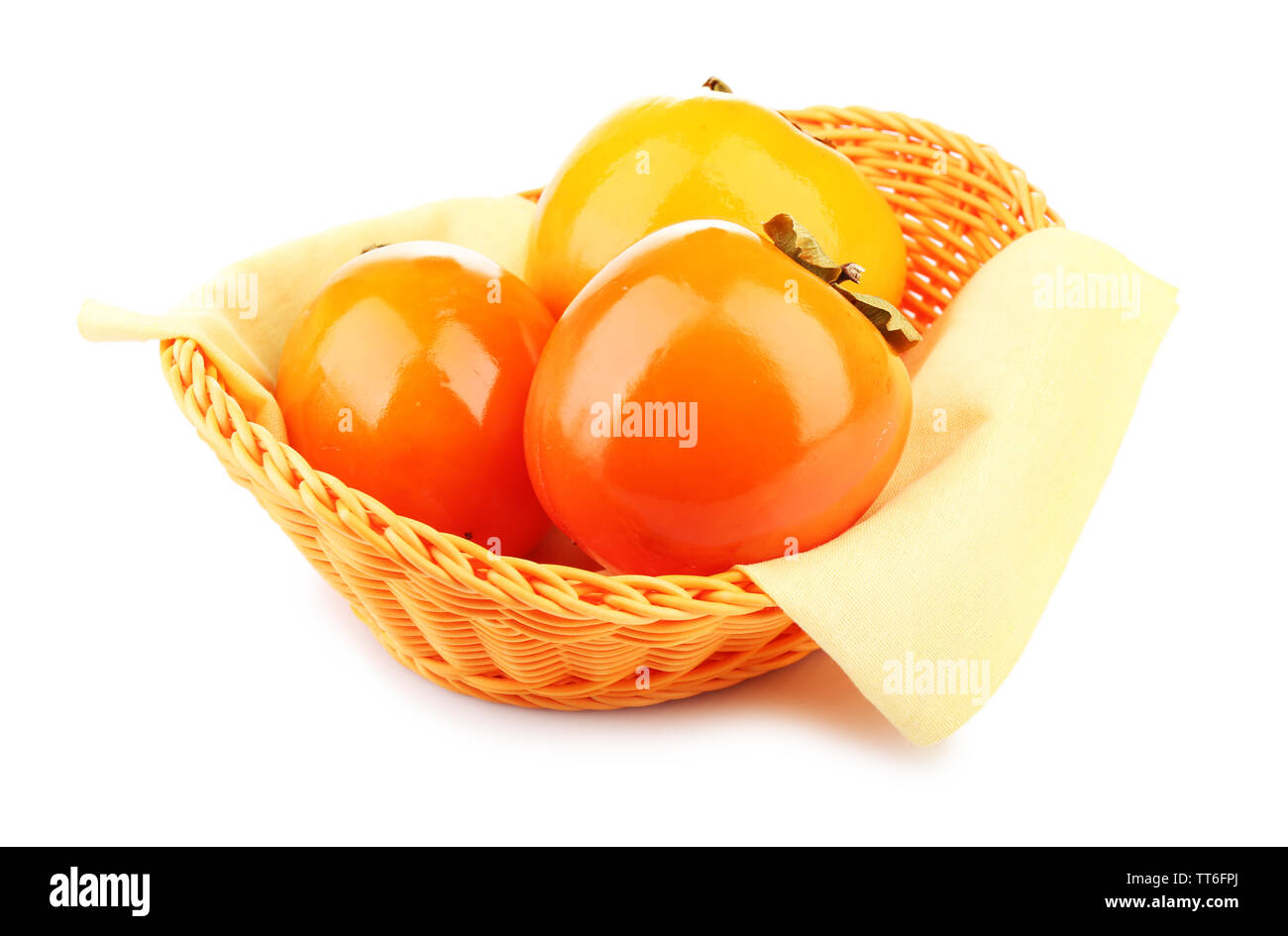 Ripe persimmons in wicker basket isolated on white Stock Photo - Alamy