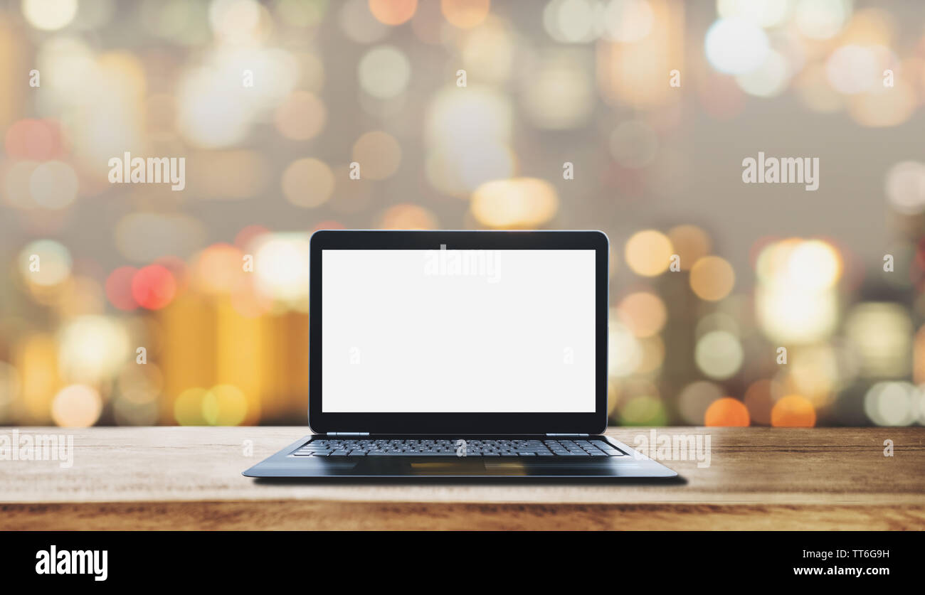 Computer laptop blank white screen on wooden desk, with blurry Bokeh ...