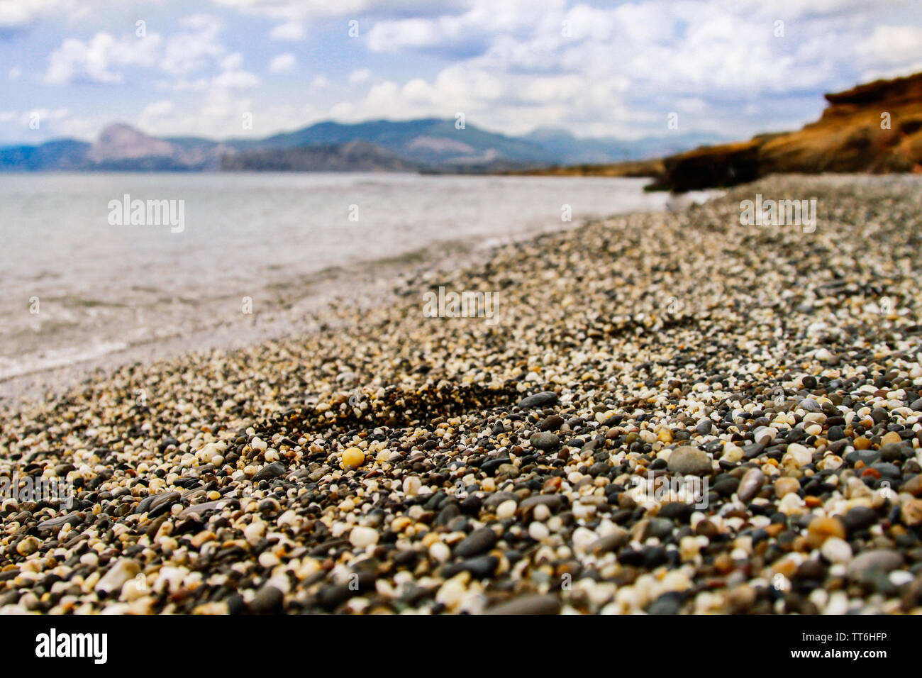 Beautiful beach background. Seashore with small stones, beach near the ...