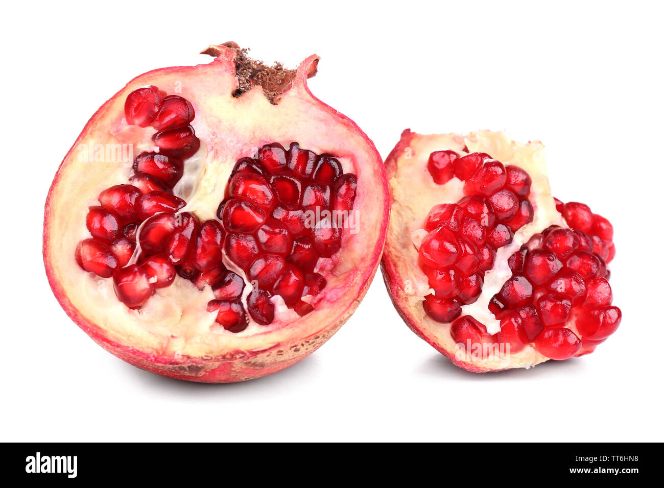 Juicy ripe pomegranates, isolated on white Stock Photo - Alamy