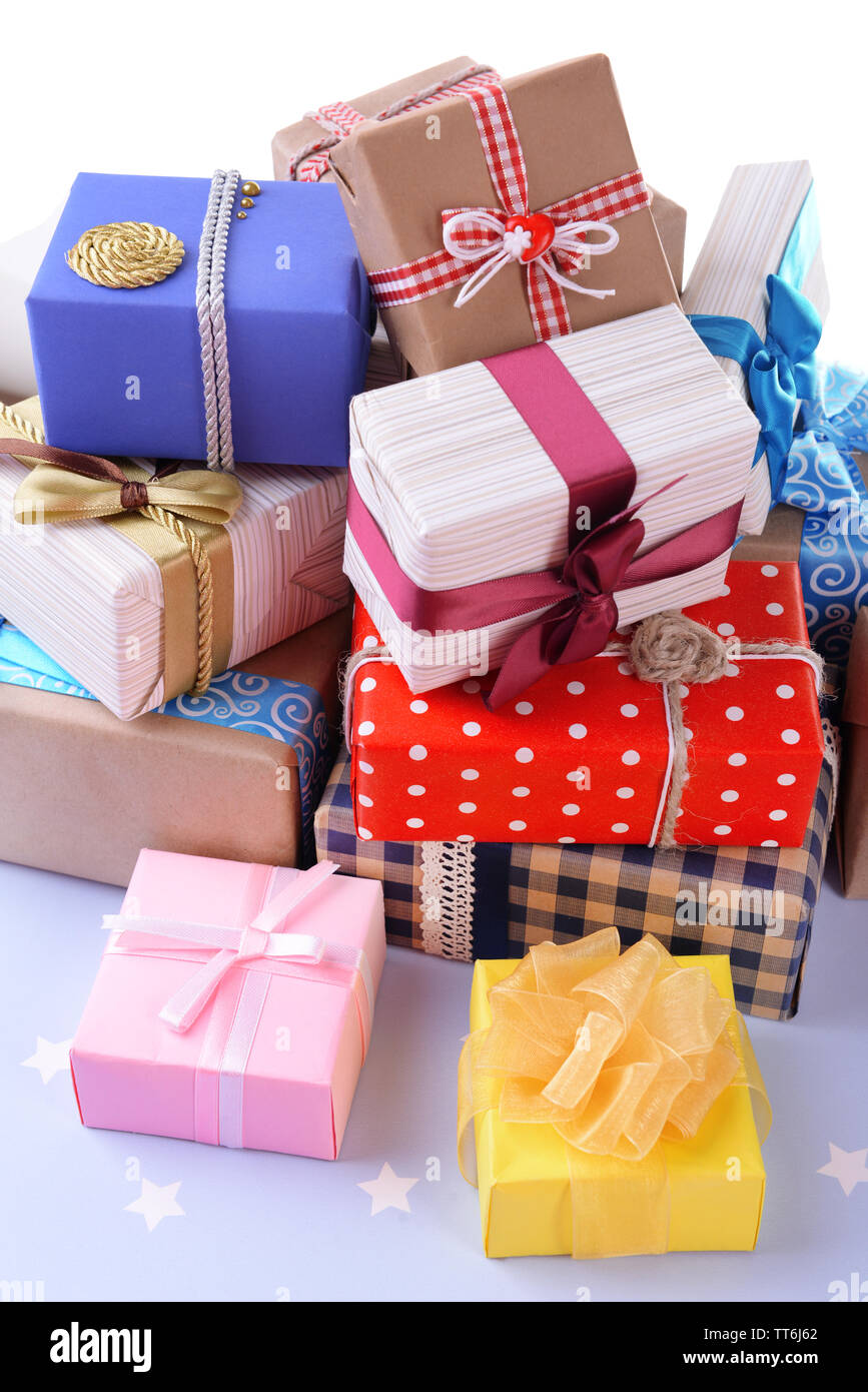Pile of colorful gifts on blue background with stars Stock Photo - Alamy