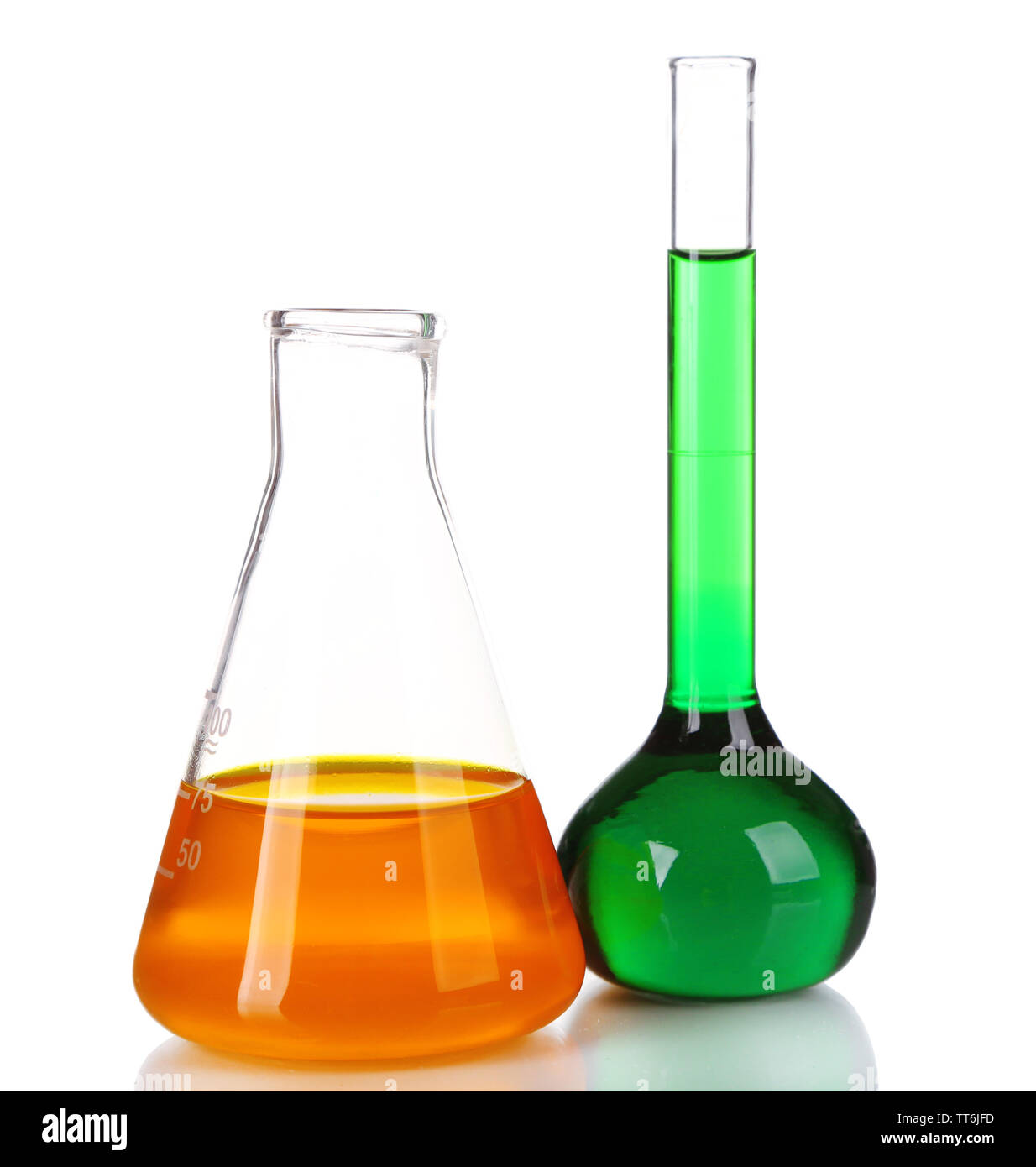 Two flasks with green and orange fluid isolated on white Stock Photo ...