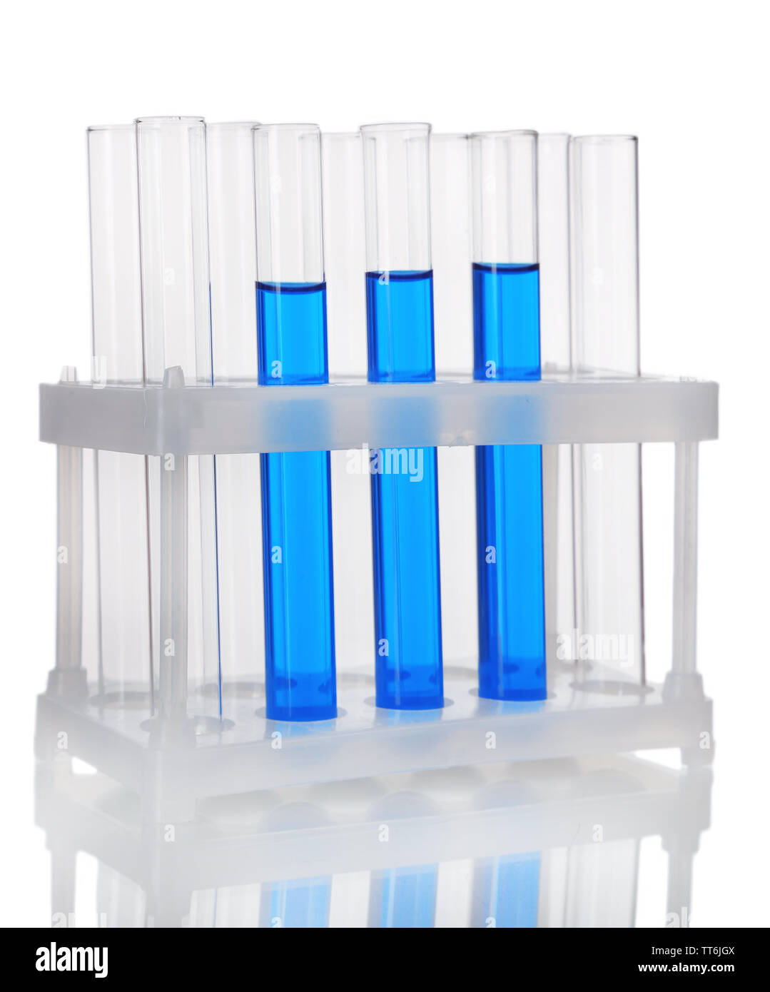 Test-tubes in container with colorful fluid isolated on white Stock ...