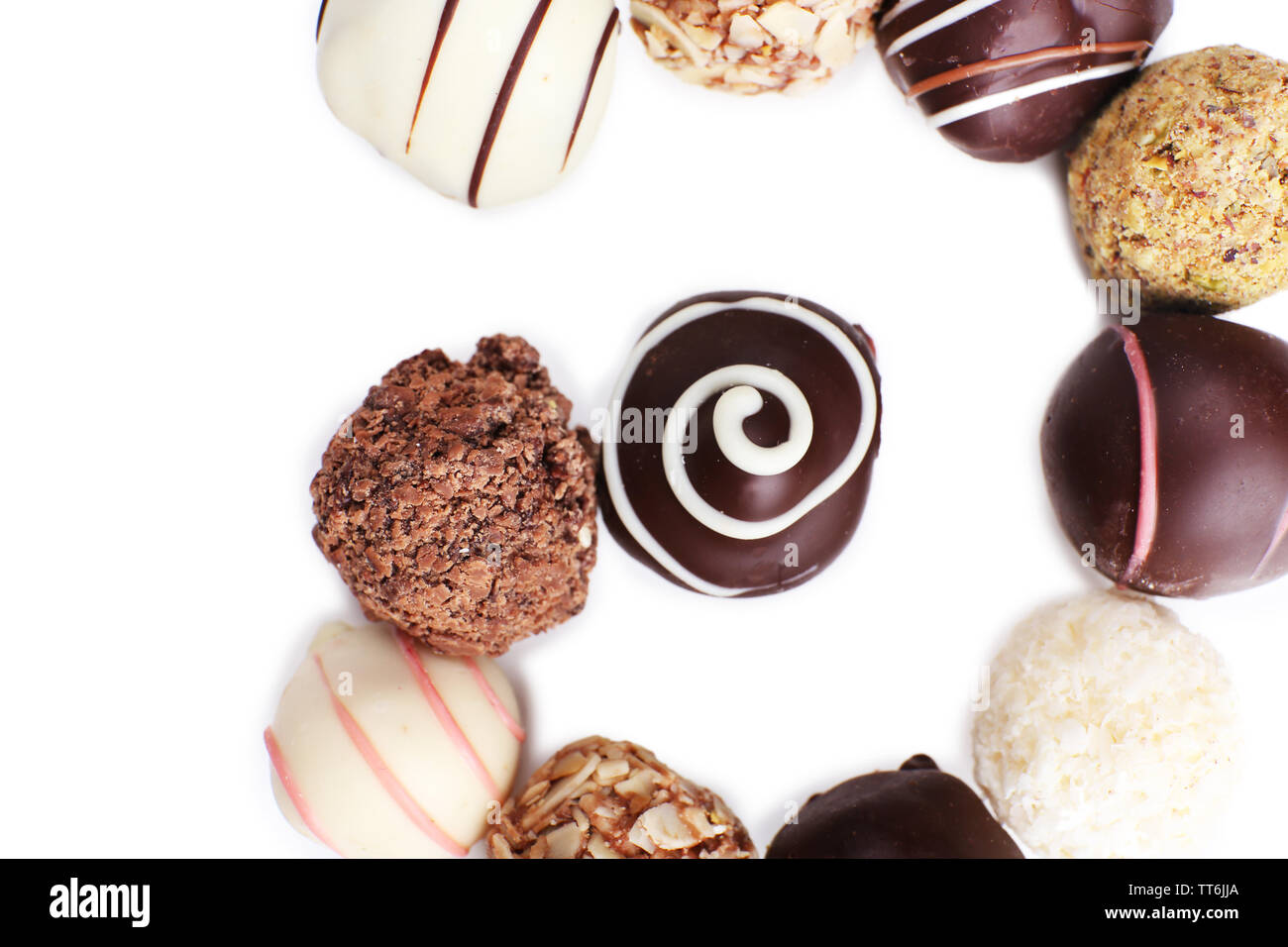Spiral of chocolate sweet candies isolated on white background Stock ...