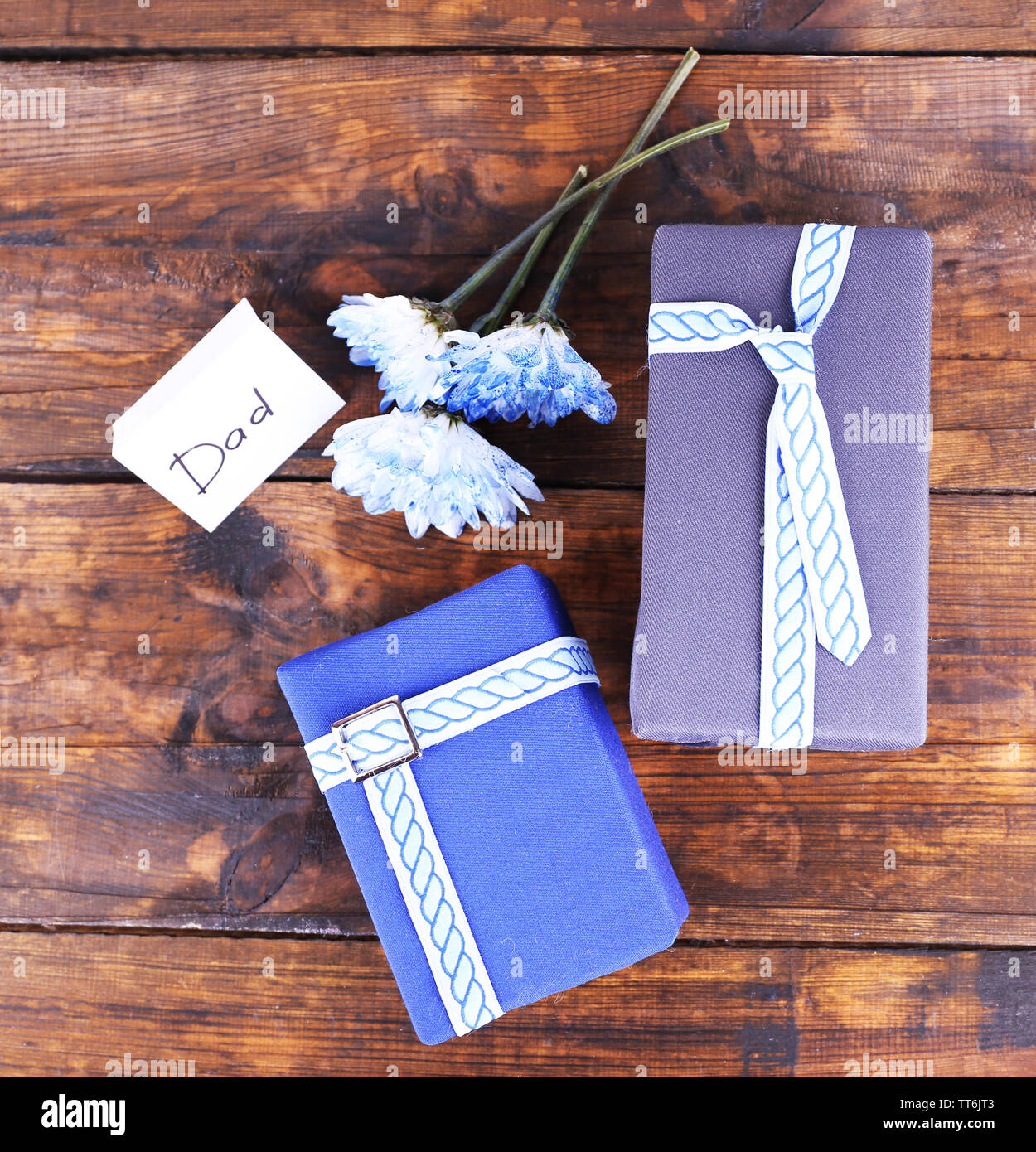 Happy Father's Day with two gift boxes, flowers and greeting card on ...