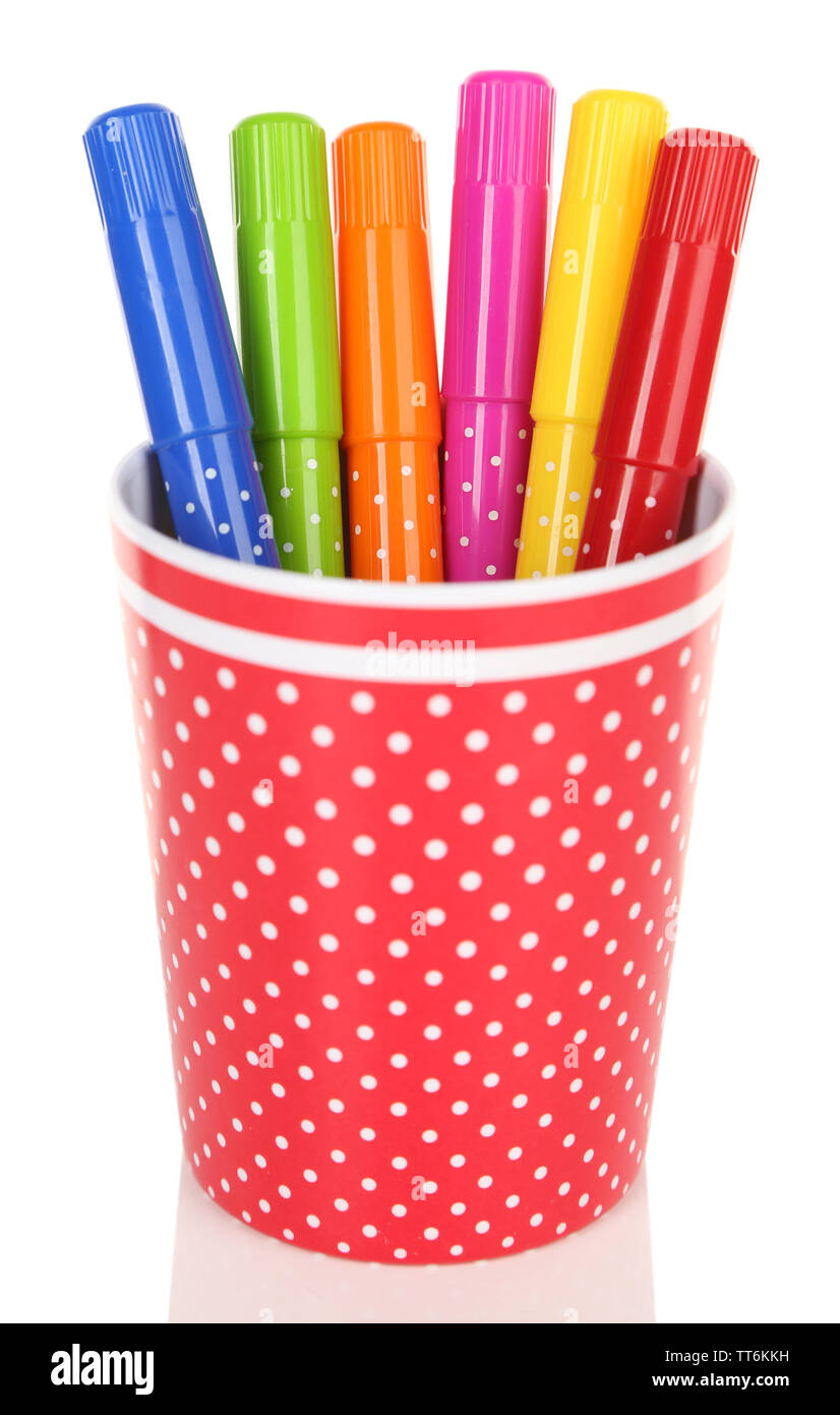 Colorful markers in red polka-dot plastic cup isolated on white ...