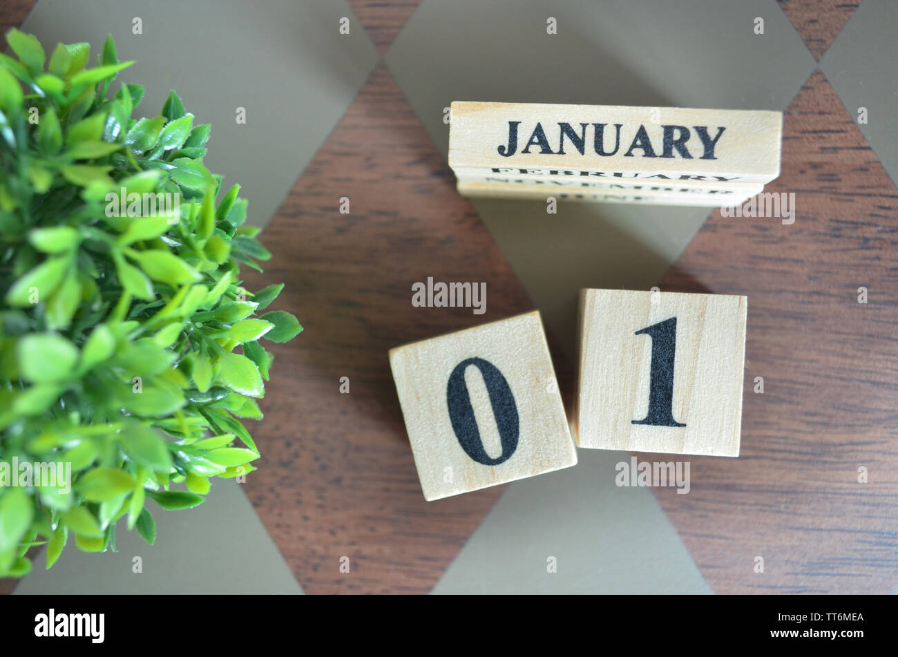 Date of February month with leaf on diamond pattern table for ...