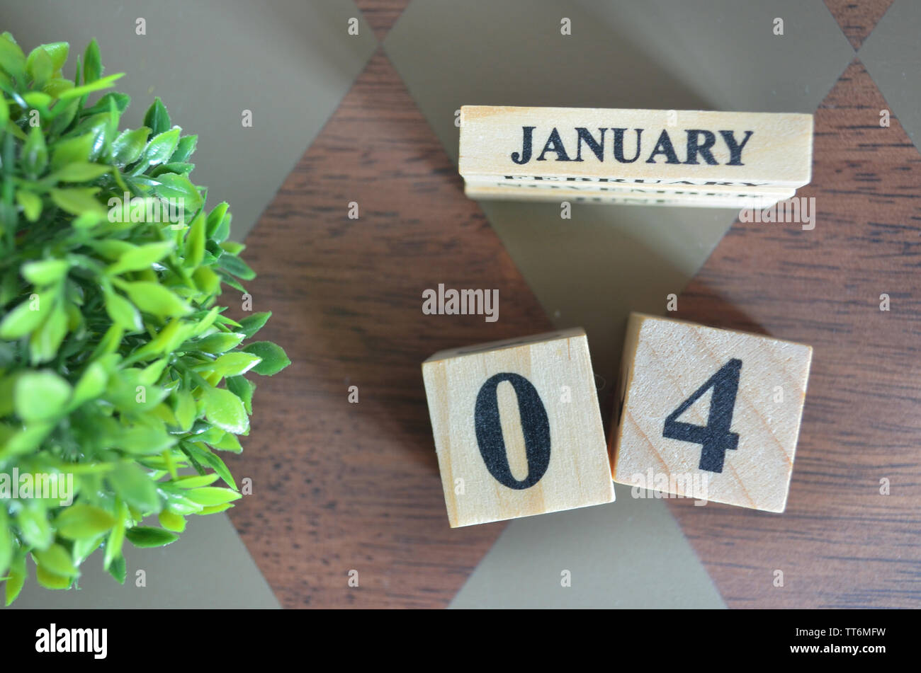 Date of February month with leaf on diamond pattern table for ...