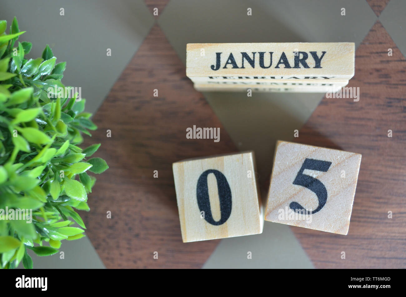 Date of February month with leaf on diamond pattern table for ...